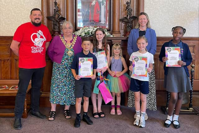 Young winners of this year's Wigan Pride T-shirt competition are revealed